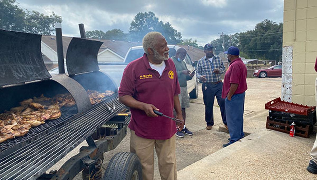 Laymen's ministry gives to others by preparing barbecue meal for The S...