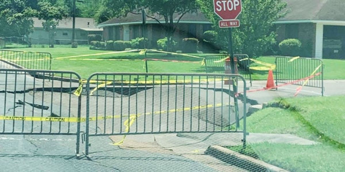 Sinkhole repair must wait until water levels subside