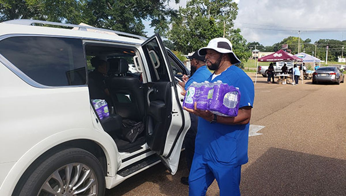 Mississippi SHINE Project distributes water, masks, hand san...