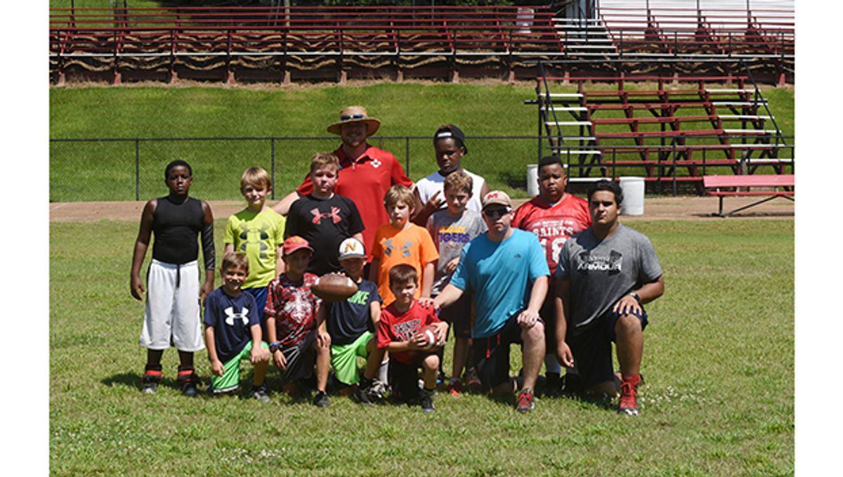 Trinity Episcopal coach hosts local youth football camp