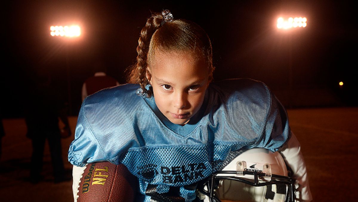 Young girl tackles AYA football