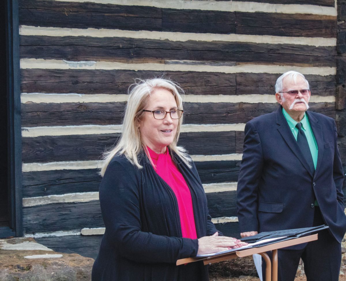 Four Oaks community helps restore log cabin