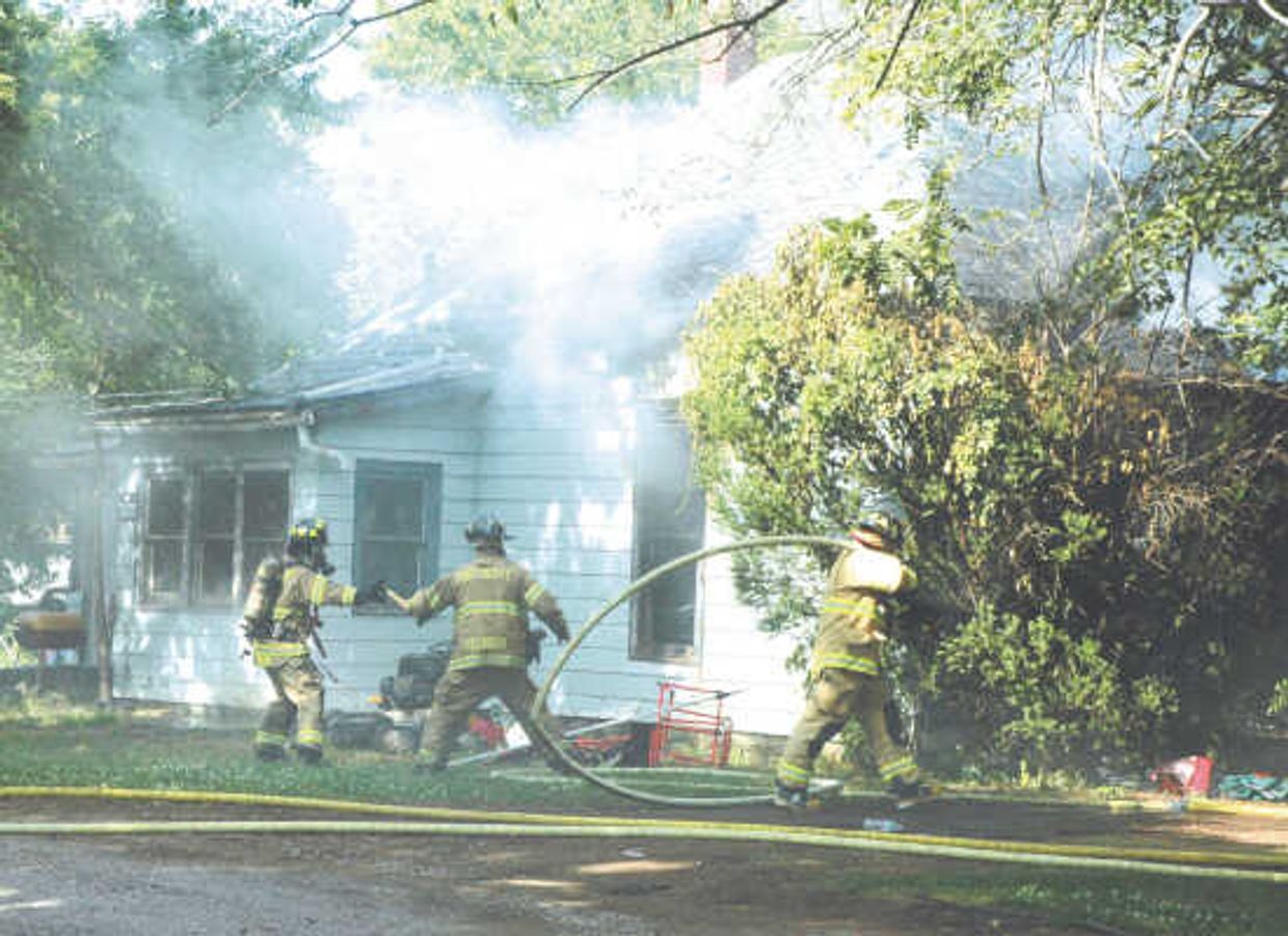 Firefighters battle blaze at house on Wall Street Friday