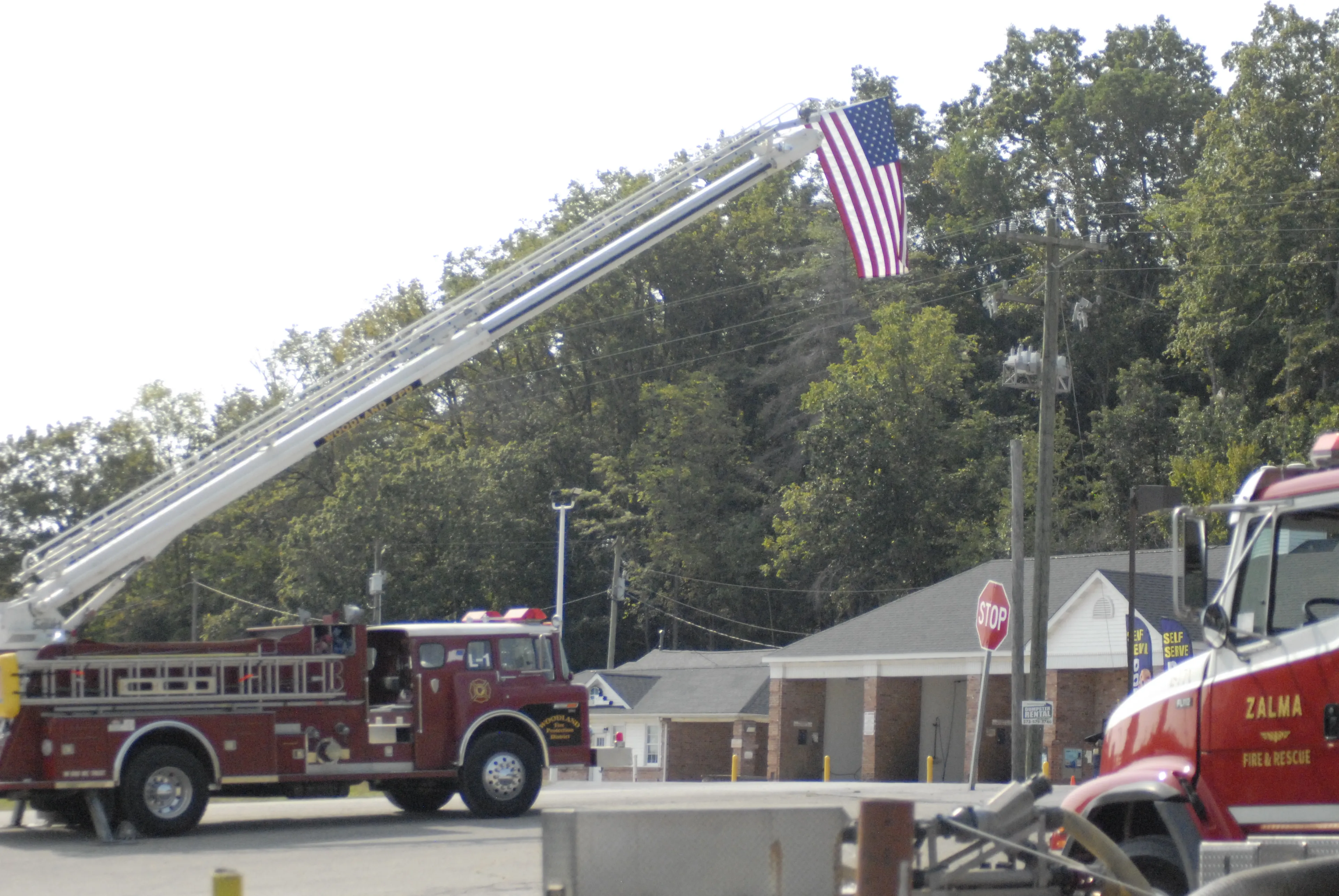 Fire department commemorates 9/11 by flying flag from ladder truck