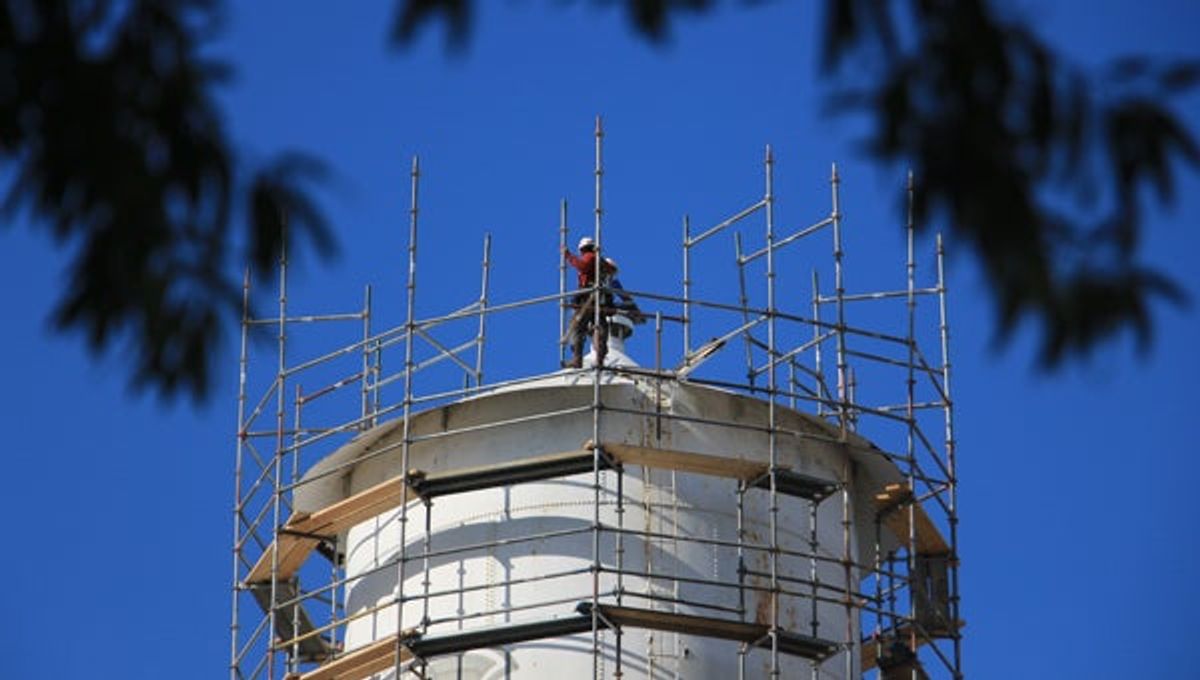 FRESH START: Downtown water tower painting begins