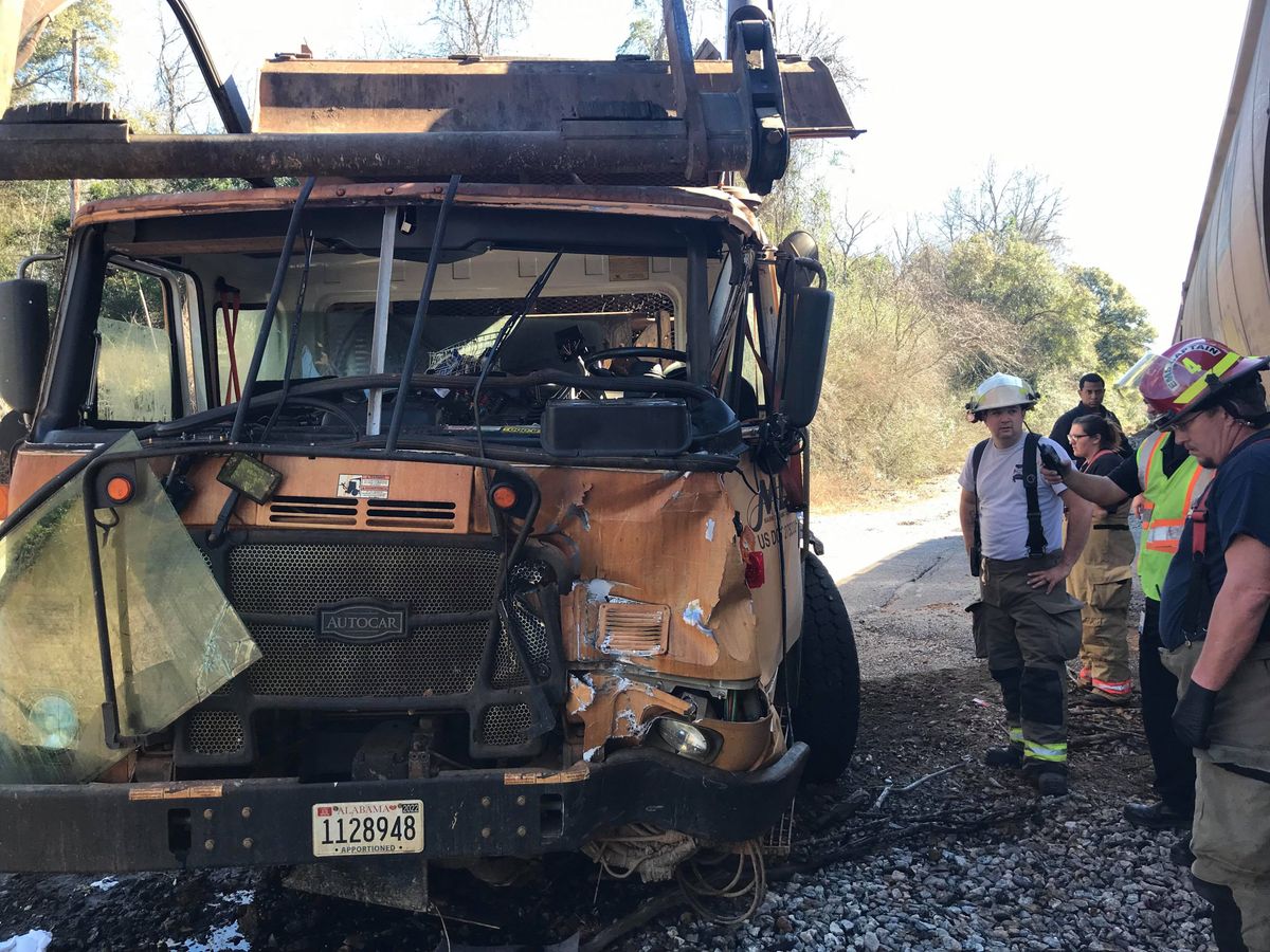 Train collides with garbage truck