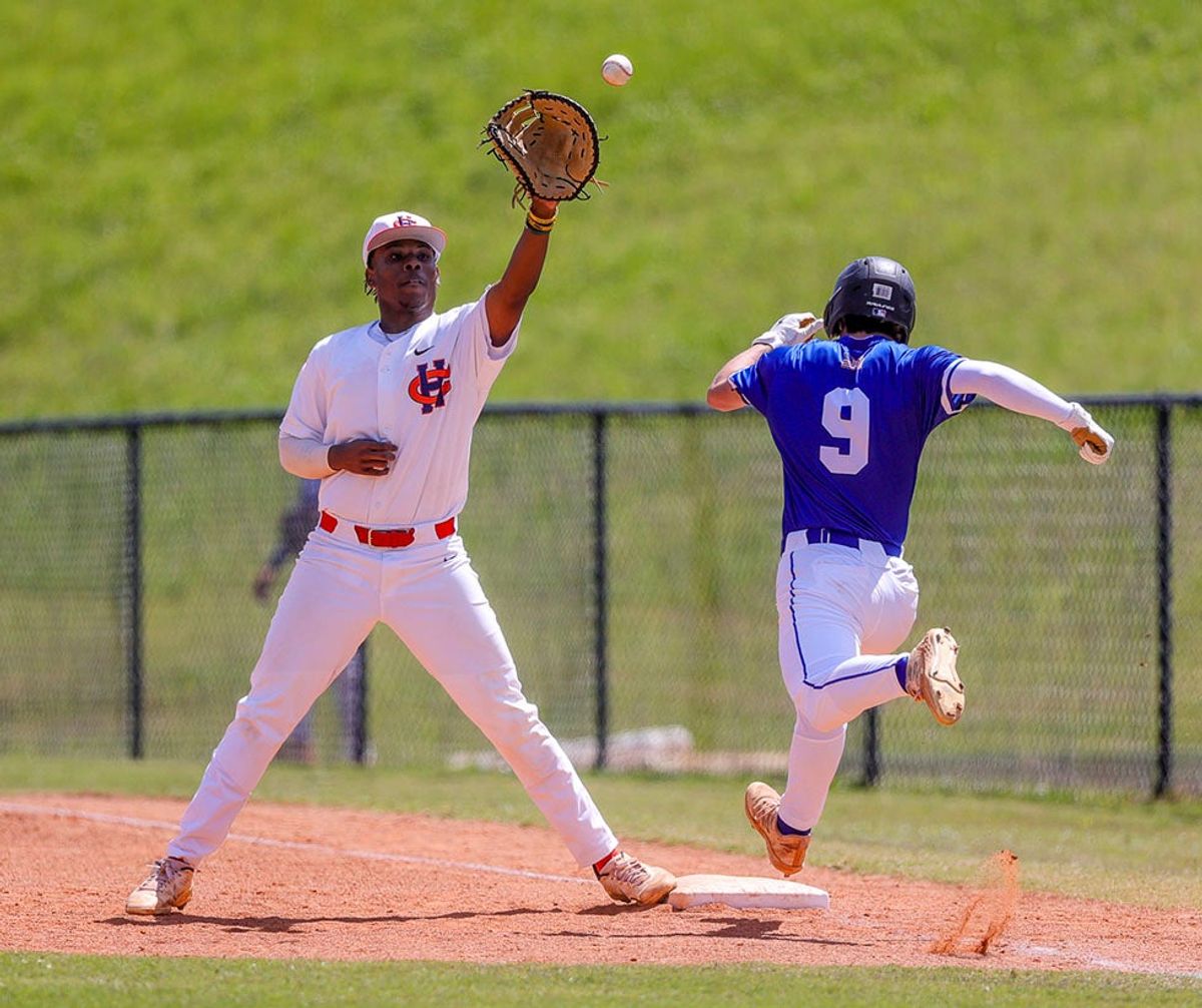 Area Baseball: Trojans, Patriots compete in Terry Sikes Memorial
