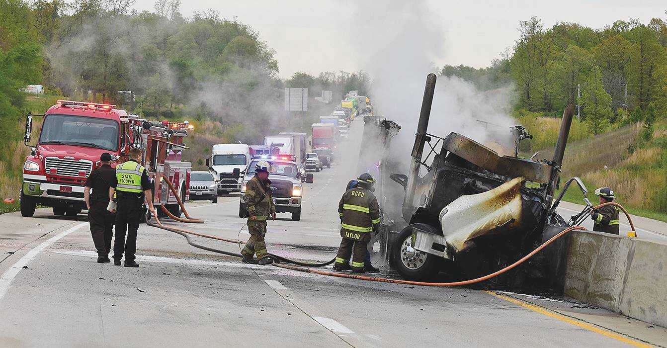 Tire blows out causing tractor-trailer to crash, catch fire
