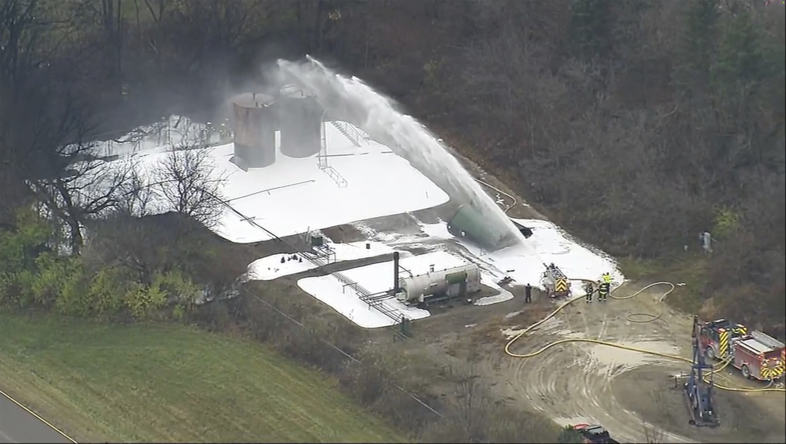 Tank containing oil drilling byproducts explodes and catches fire near...