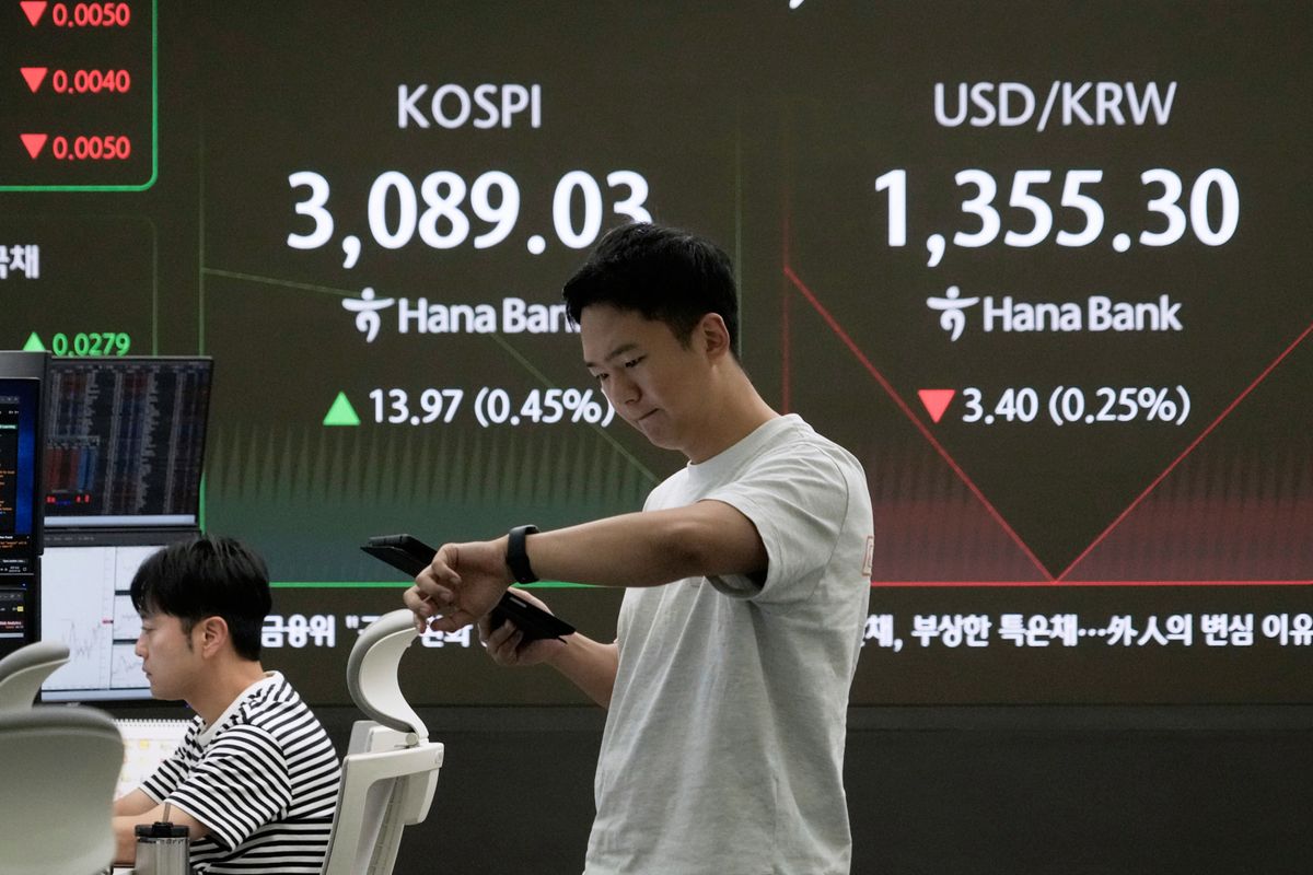 Asian shares mostly higher after US stocks hit another record as Tesla...
