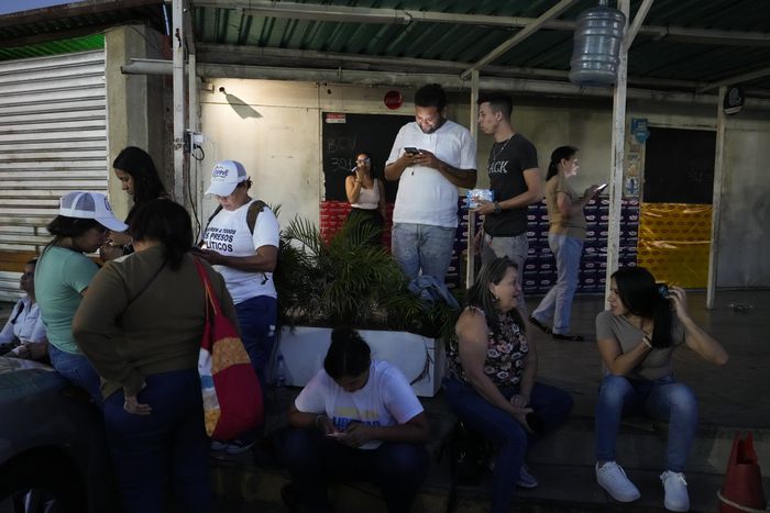 Photos show relatives waiting outside prisons as Venezuela frees a han...