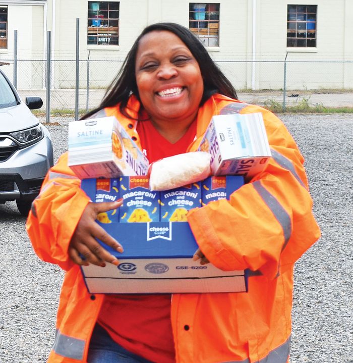 Despite rain and cold, community rallies for food drive to help famili...