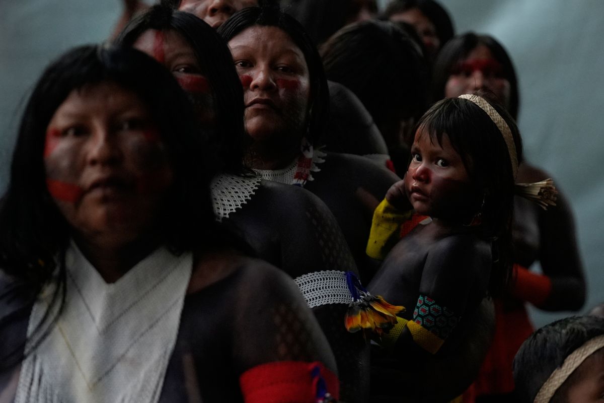 Photos show Indigenous participants at the People's Summit held alongs...