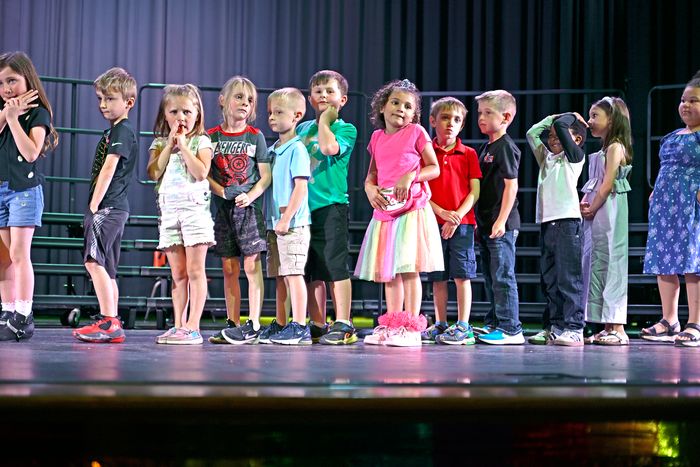Class of 2037 walks across the stage in kindergarten graduation