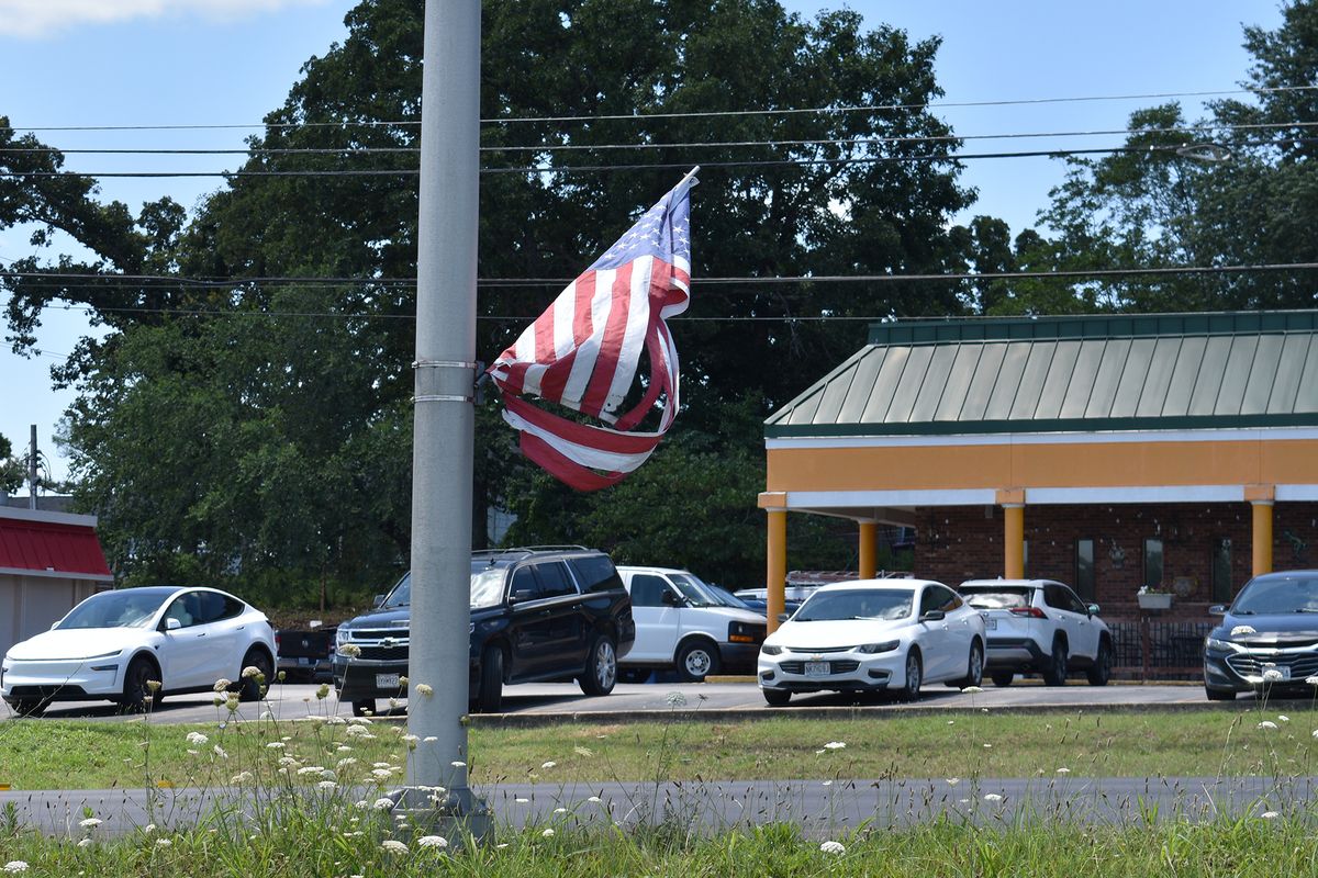 Business steps up to replace worn American flags along city ...