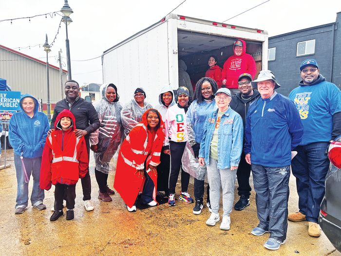 Despite rain and cold, community rallies for food drive to help famili...