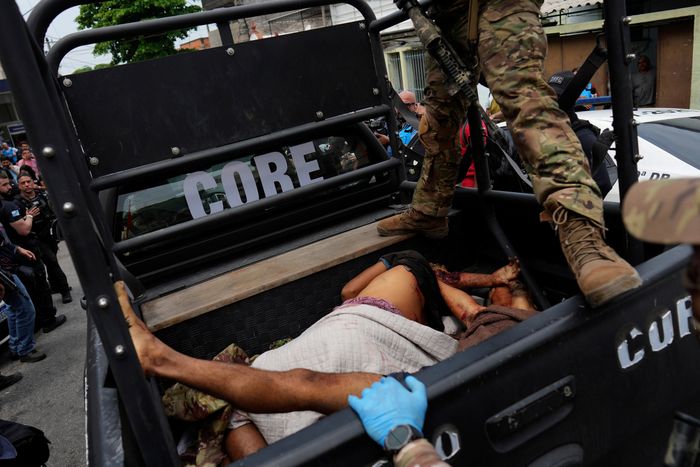 Photos show massive police raid in Rio's favelas leaving dozens dead i...