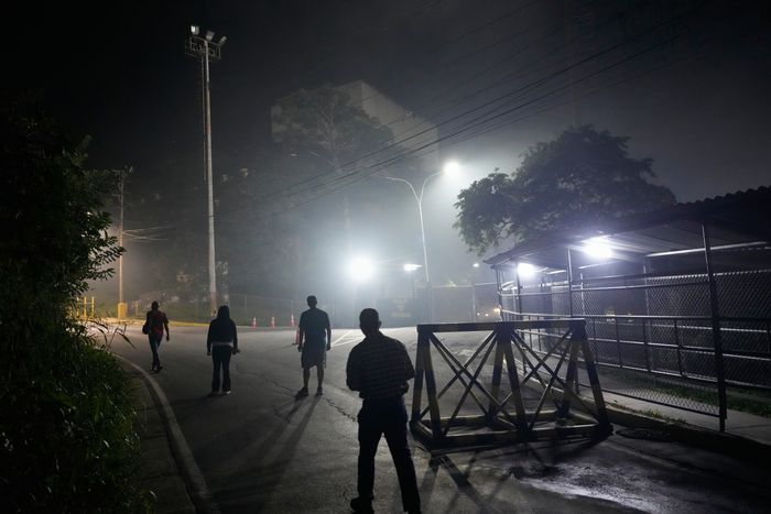 Photos show relatives waiting outside prisons as Venezuela frees a han...