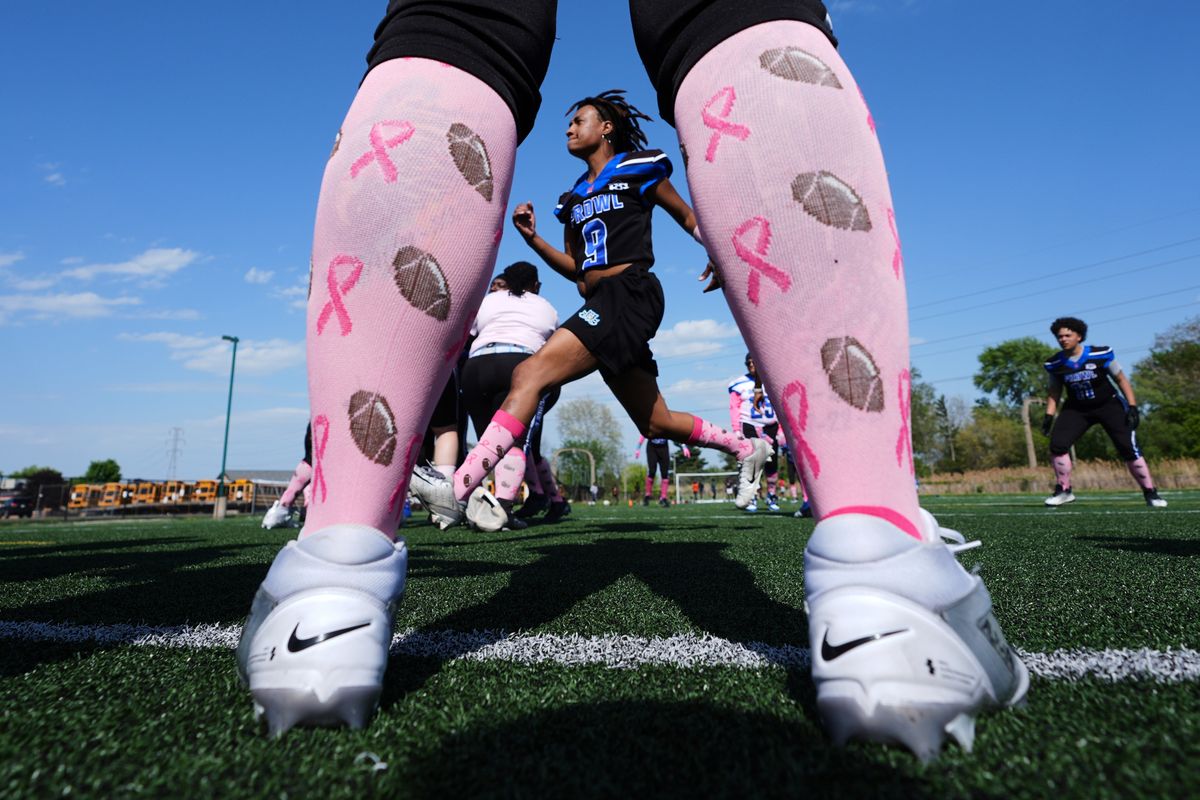 Photos of women's tackle football show opportunities for female athlet...