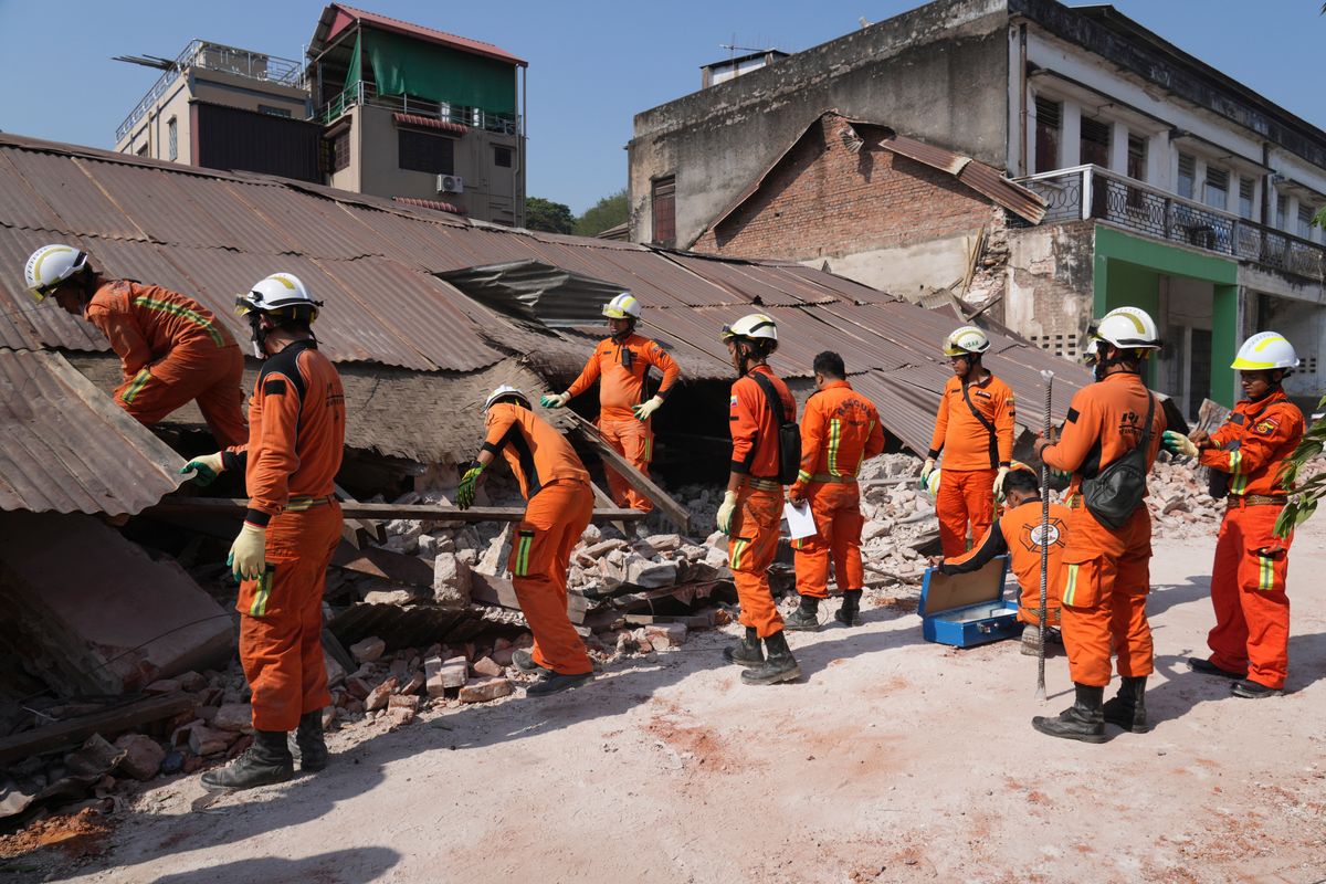A woman is rescued from rubble in Myanmar but hope is fading...
