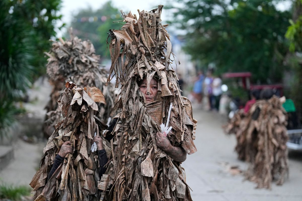 Philippine devotees honor St. John the Baptist with a mud-co...