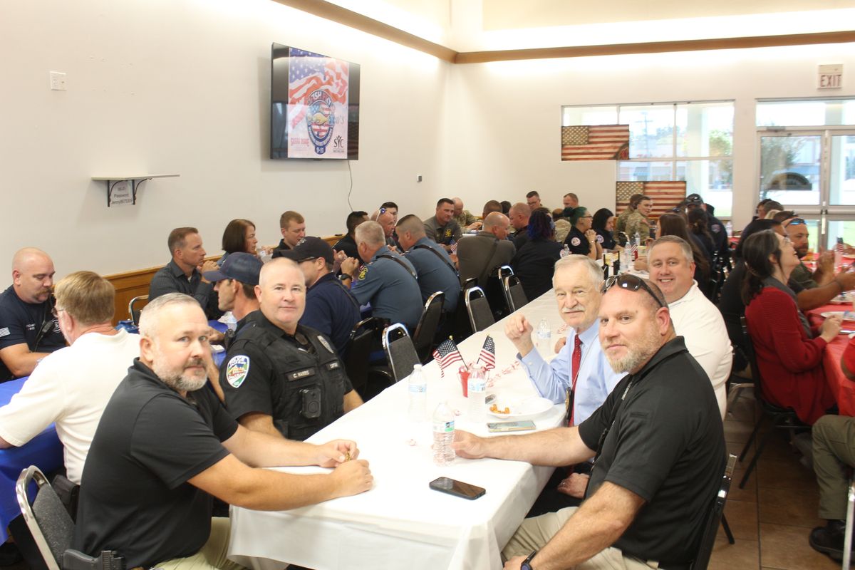 Community gathers to thank first responders with food, flags...