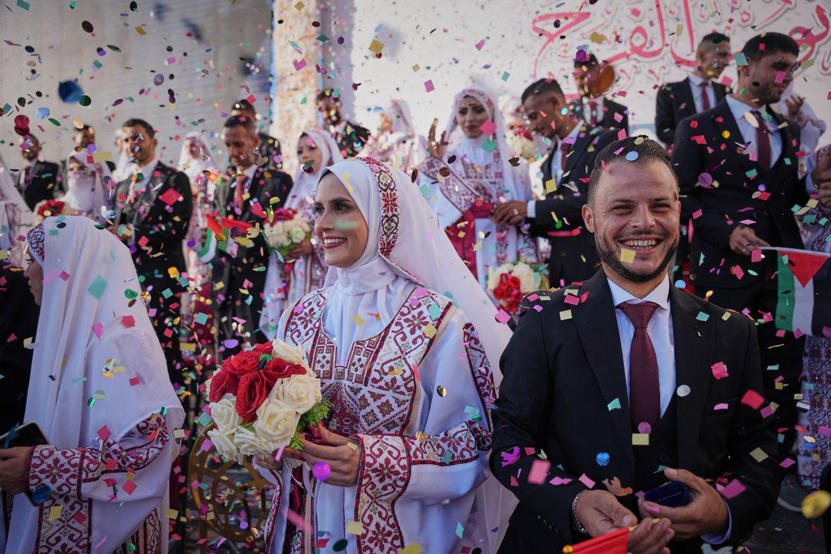 Photos of Palestinian couples celebrating a mass wedding in Gaza durin...