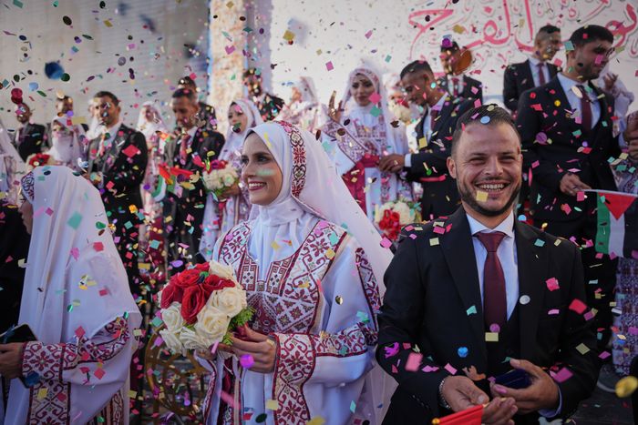 Photos of Palestinian couples celebrating a mass wedding in Gaza durin...