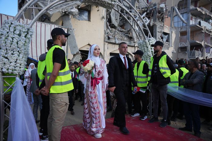 Photos of Palestinian couples celebrating a mass wedding in Gaza durin...