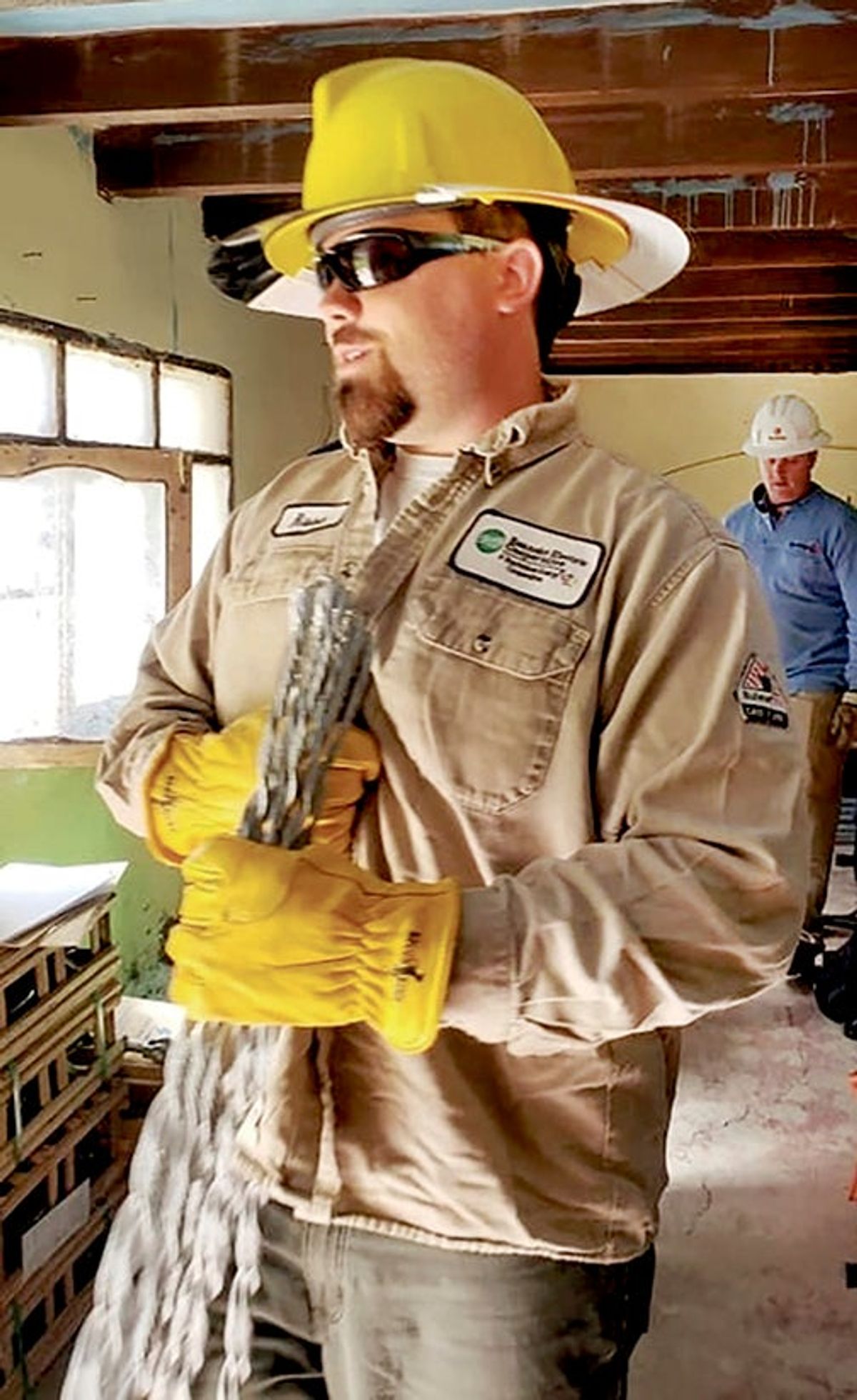 REC linemen help bring electricity to residents of small vil...