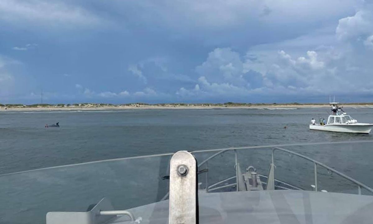 USCG Station Oregon Inlet comes to aid of capsized boat with assistanc...