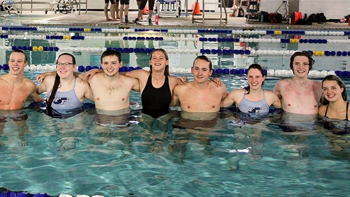 First Flight wins final regular season swim meet