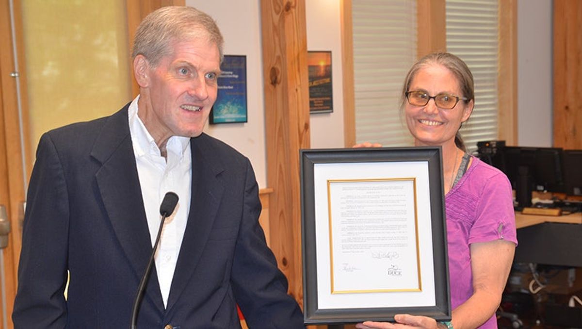 Duck honors retiring director of community development