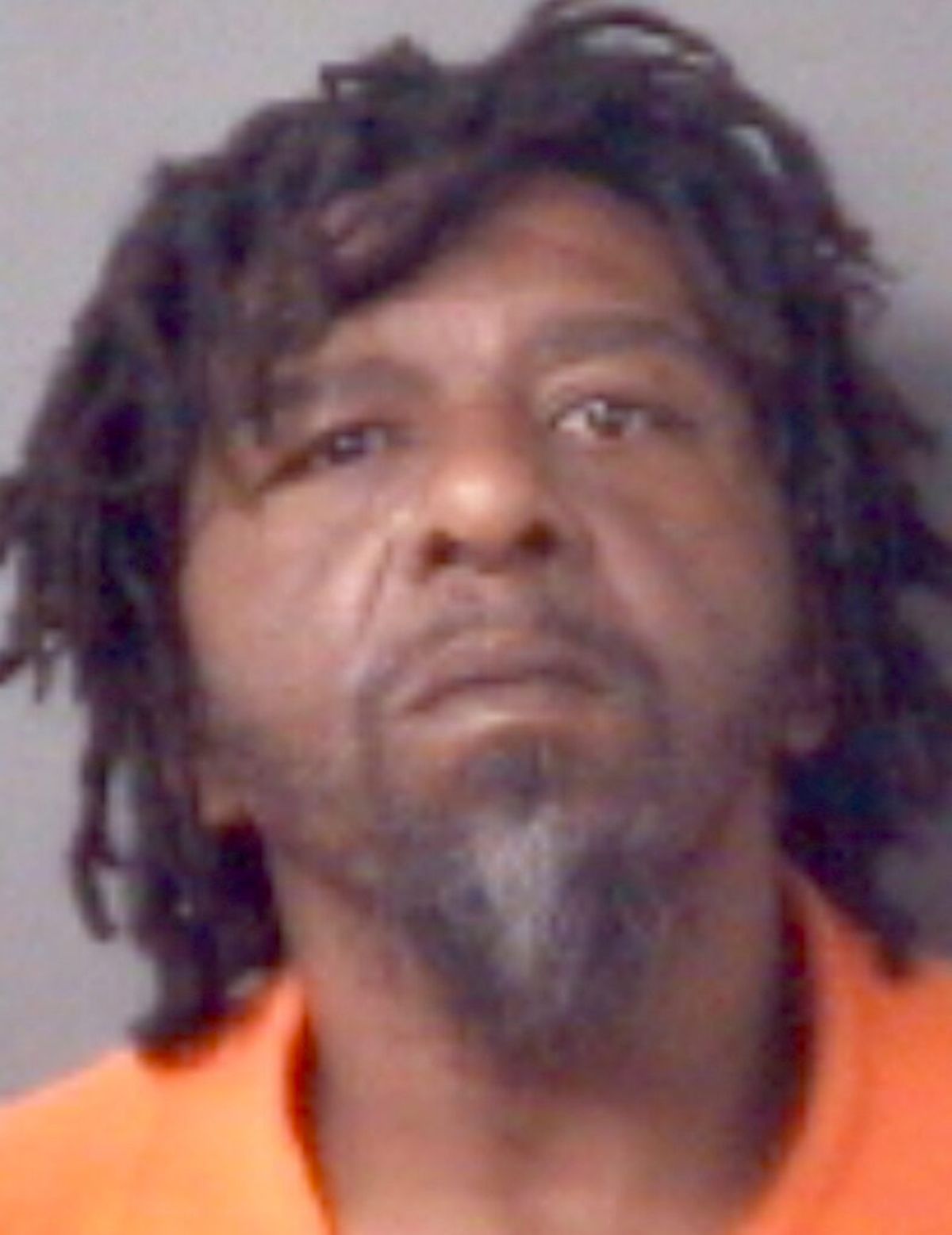 Man charged after shots fired at woman