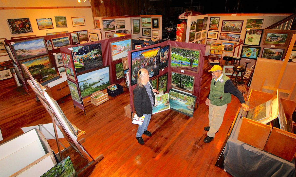 Artist selling his work to support hunger causes