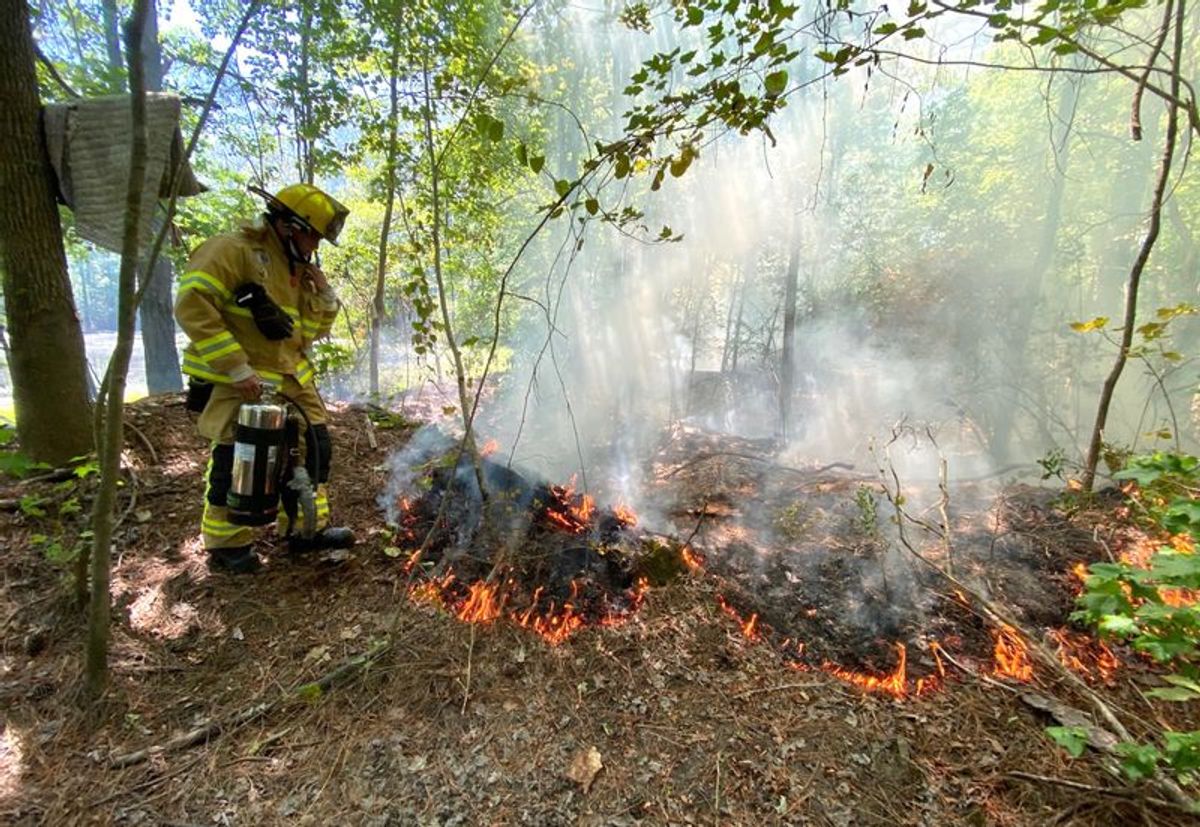 Brush fire burns near campsite; officials warn of high fire danger