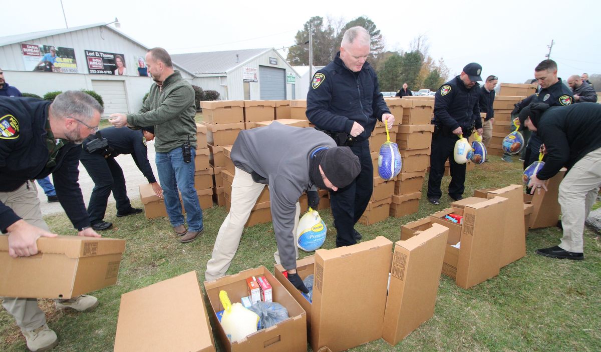 Police hand out Thanksgiving turkey boxes