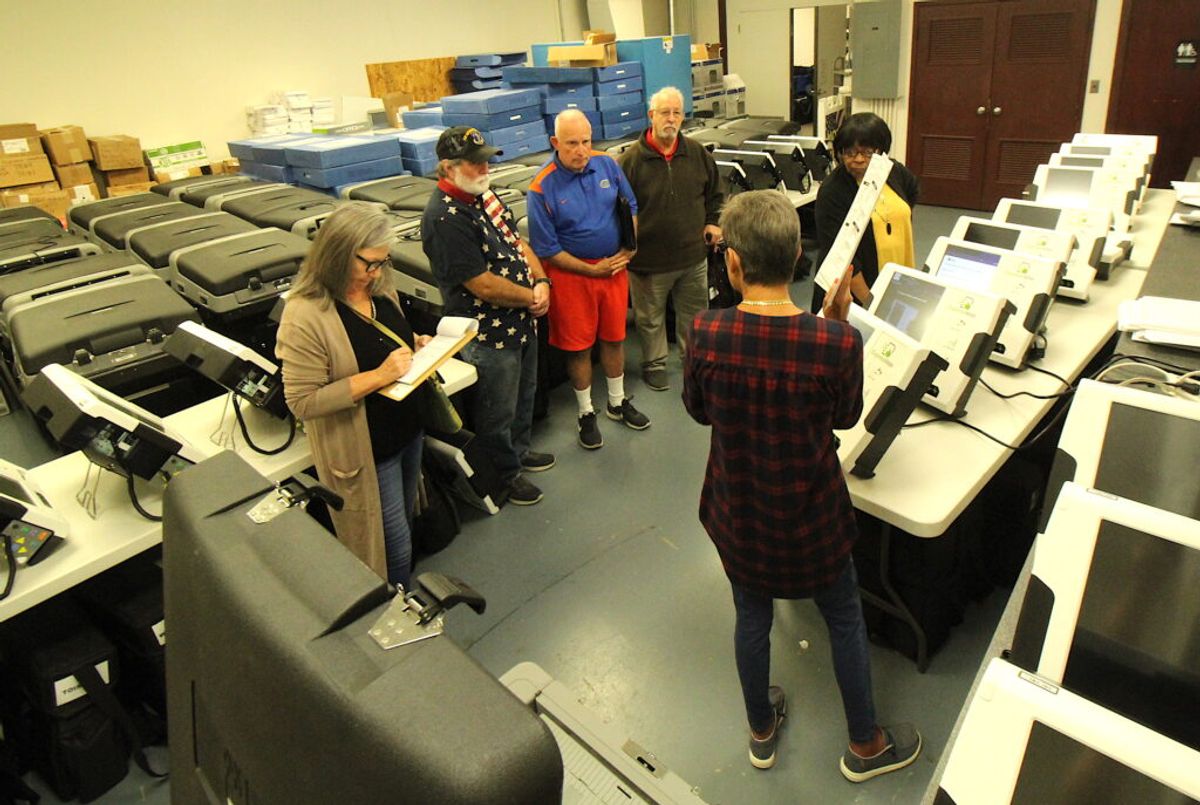 Election officials test ballot-counting machines