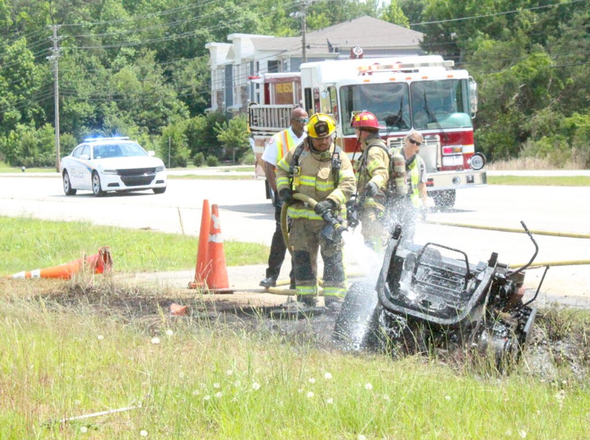 Lawn mower catches fire near funeral home