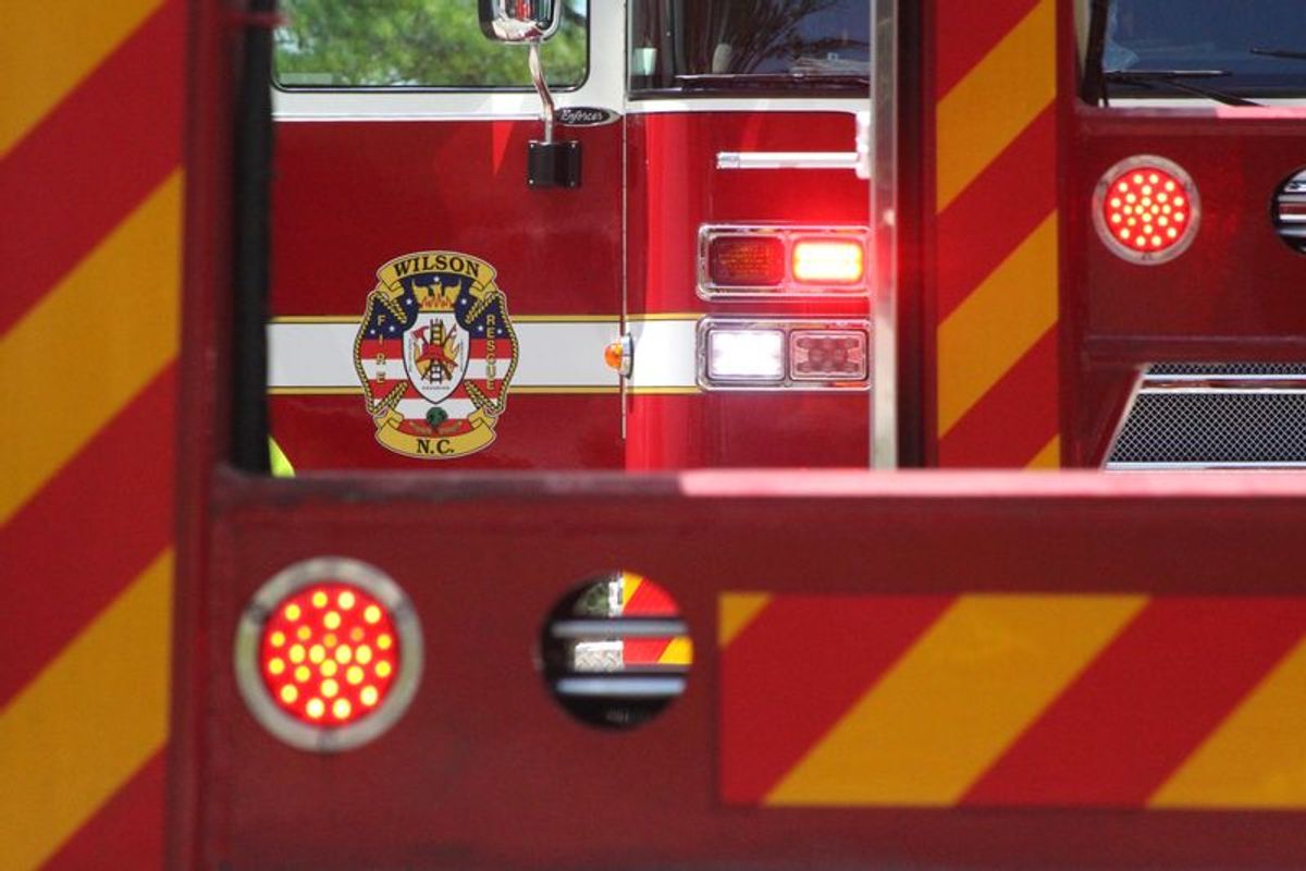 Fire spreads through attic, burns through roof