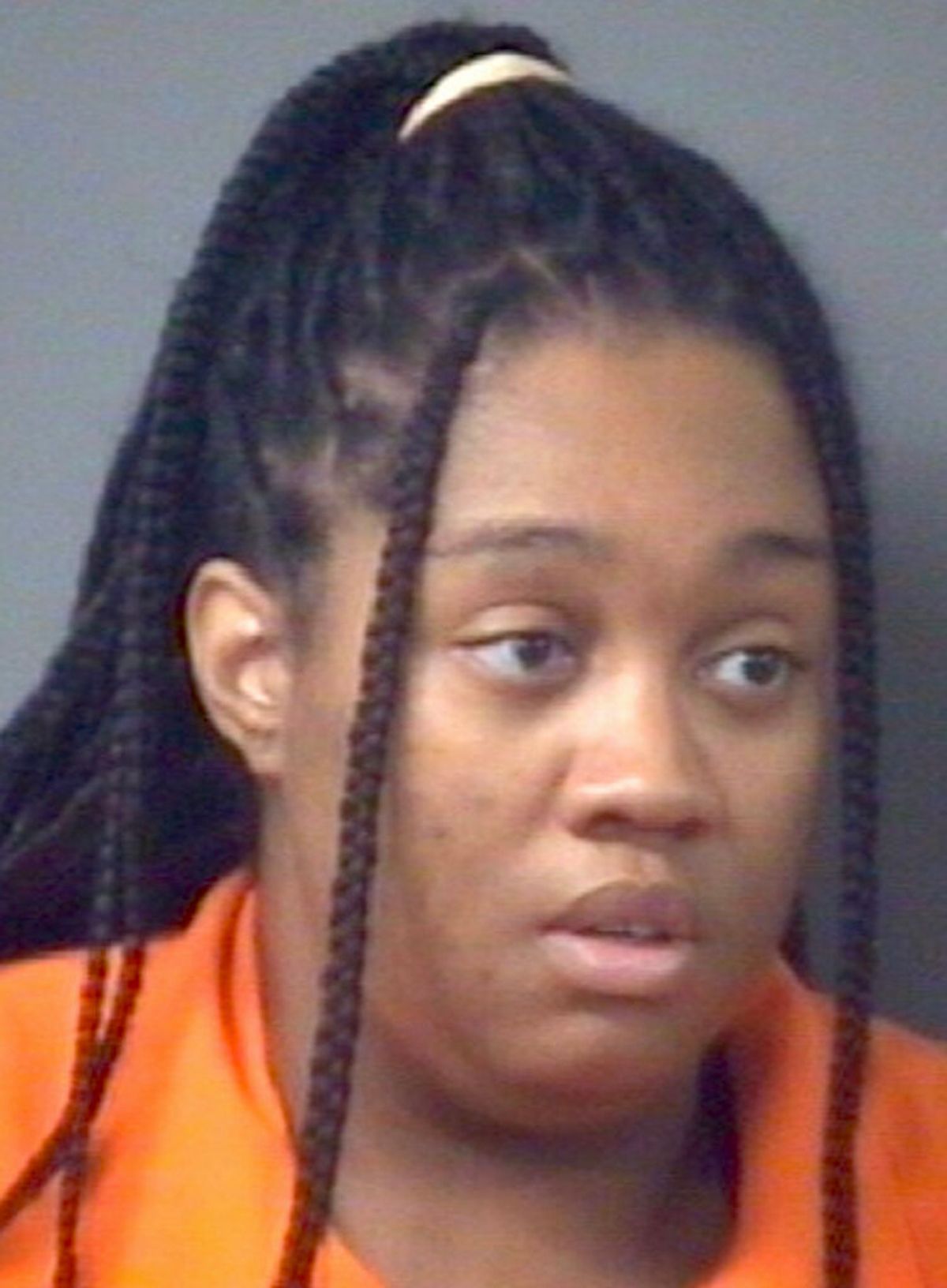 Police: Woman fired gun at 5 people in home