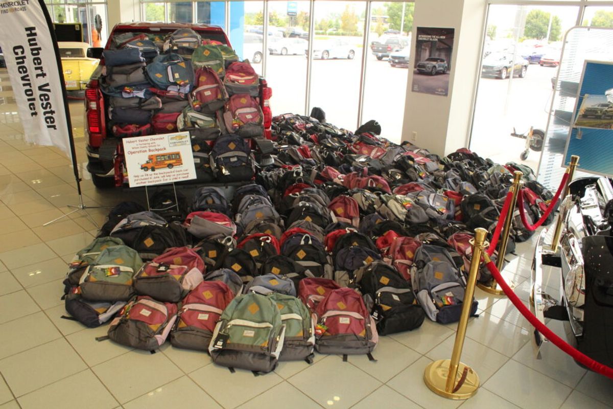 Vester Auto Group buys mountain of backpacks