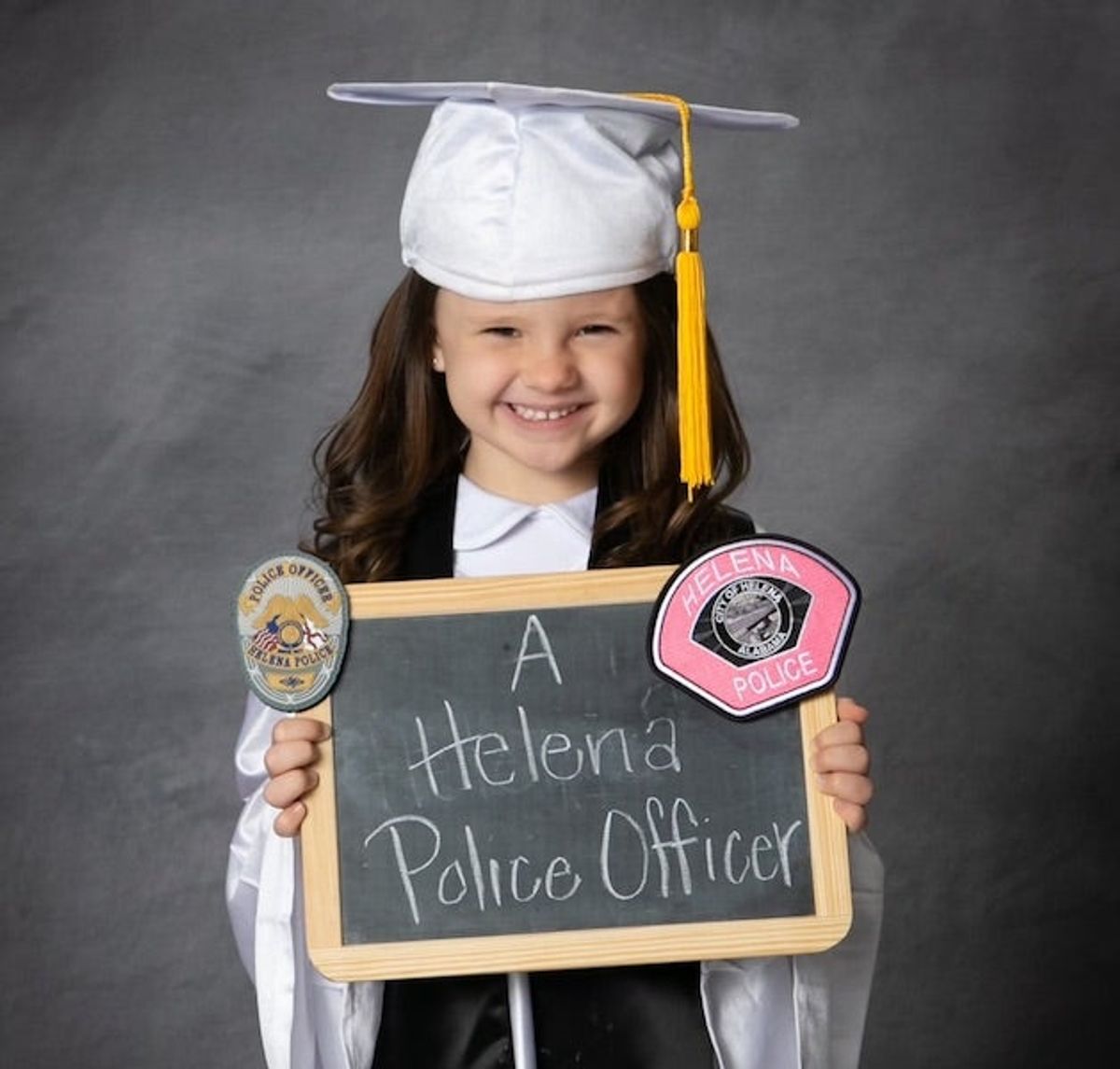 Helena's Ellie Guy receives surprise badge from Helena PD