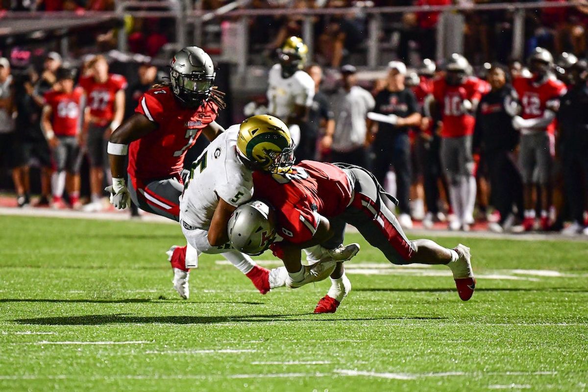 Thompson drops defensive battle with Grayson in overtime