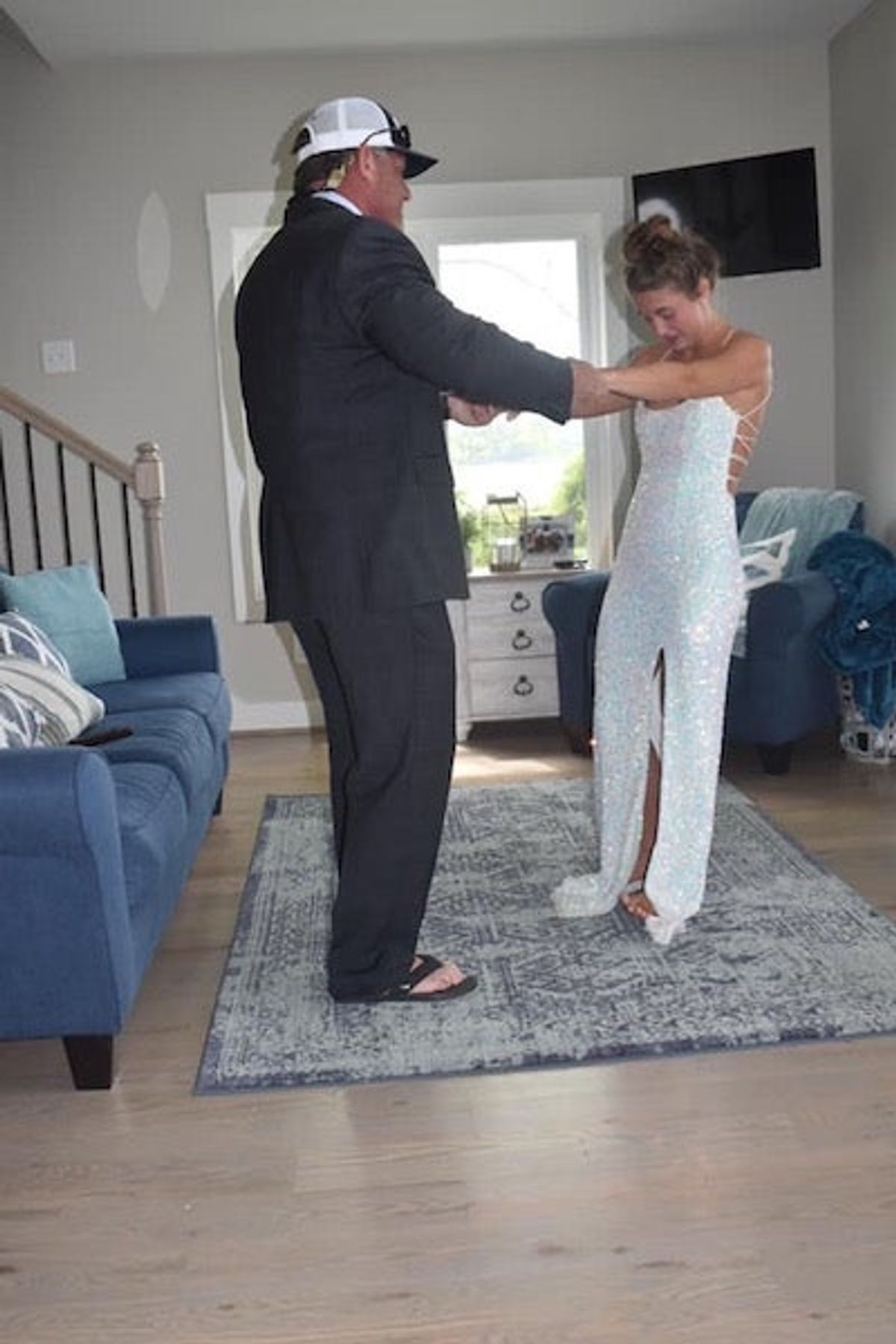 'A special moment:' Dad surprises daughter with prom dance a...