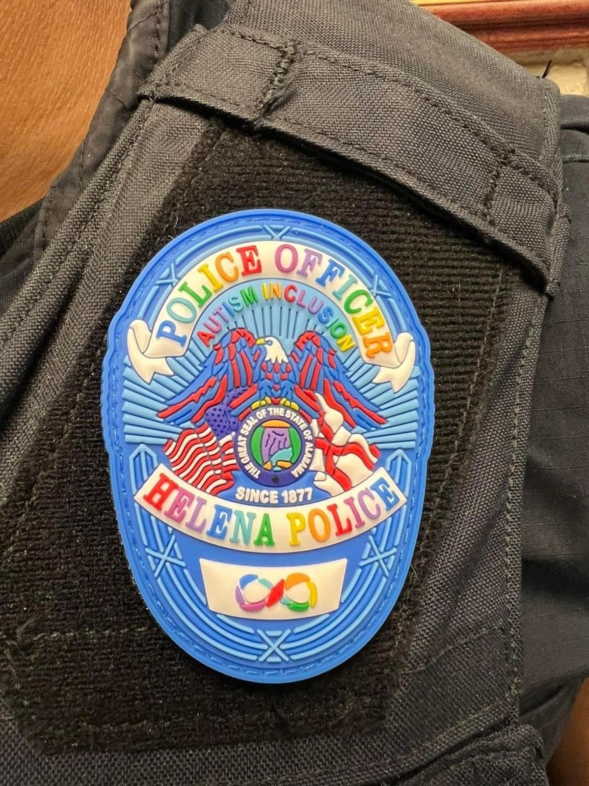 Helena Police Department dons new badges for Autism Awareness month