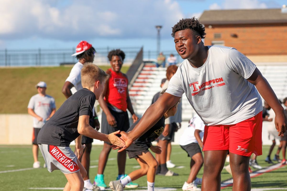Thompson football gives back to community with annual footba...