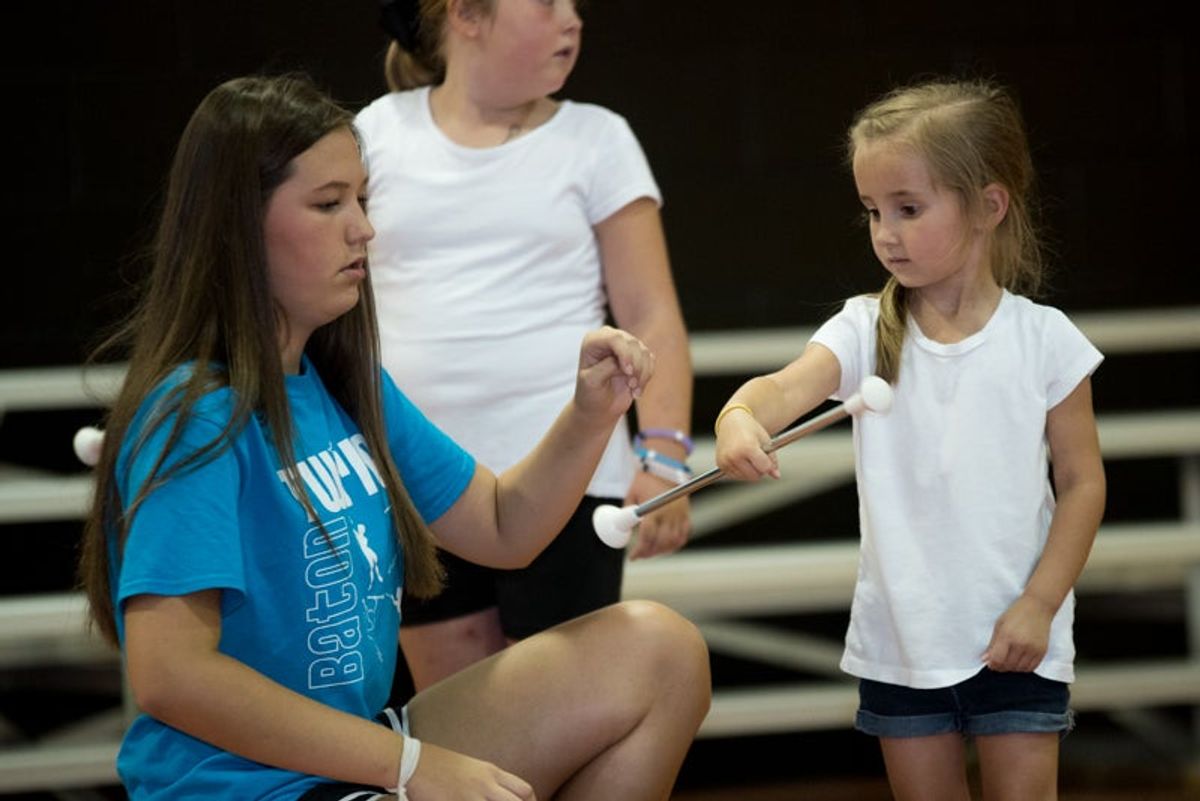 Girls explore baton at twirling clinic