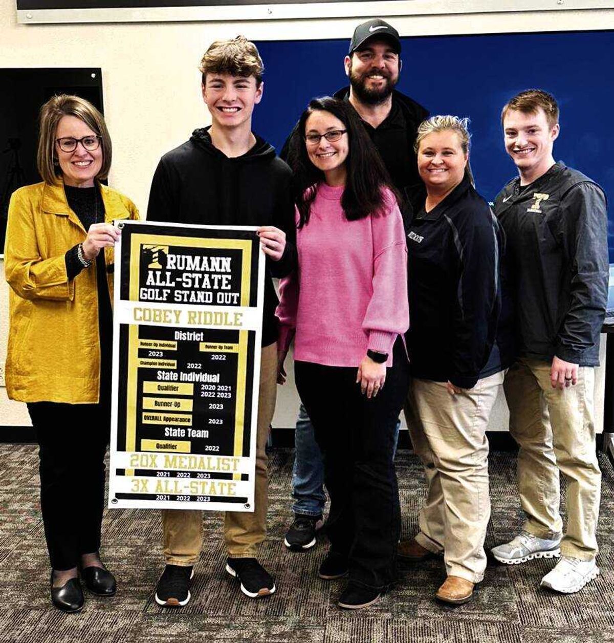 Banner shows Riddle's golf accomplishments