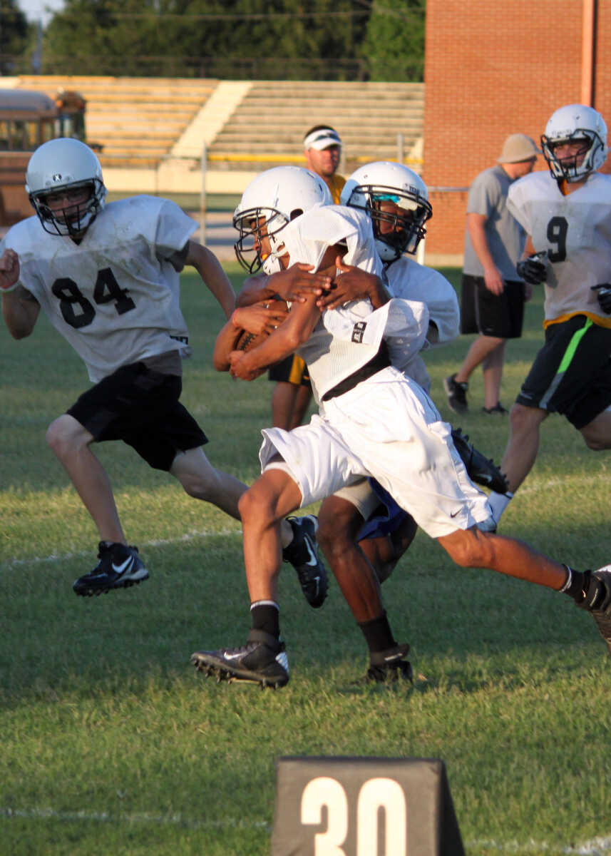 Kennett football team in action at football camp